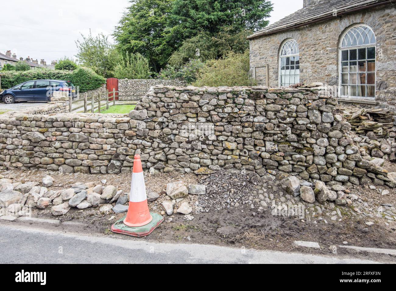 Restoration & rebuild of a stone wall in Long Preston adjacent to ...