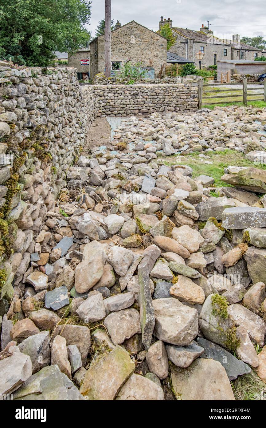 Restoration & rebuild of a stone wall in Long Preston adjacent to ...