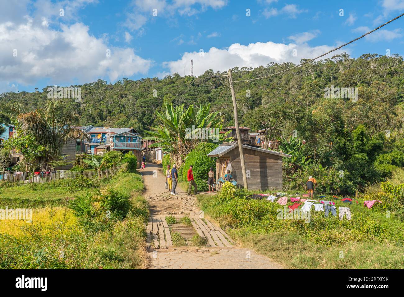 Andasibe, Madagascar - May 26.2023: People walking along the road in ...