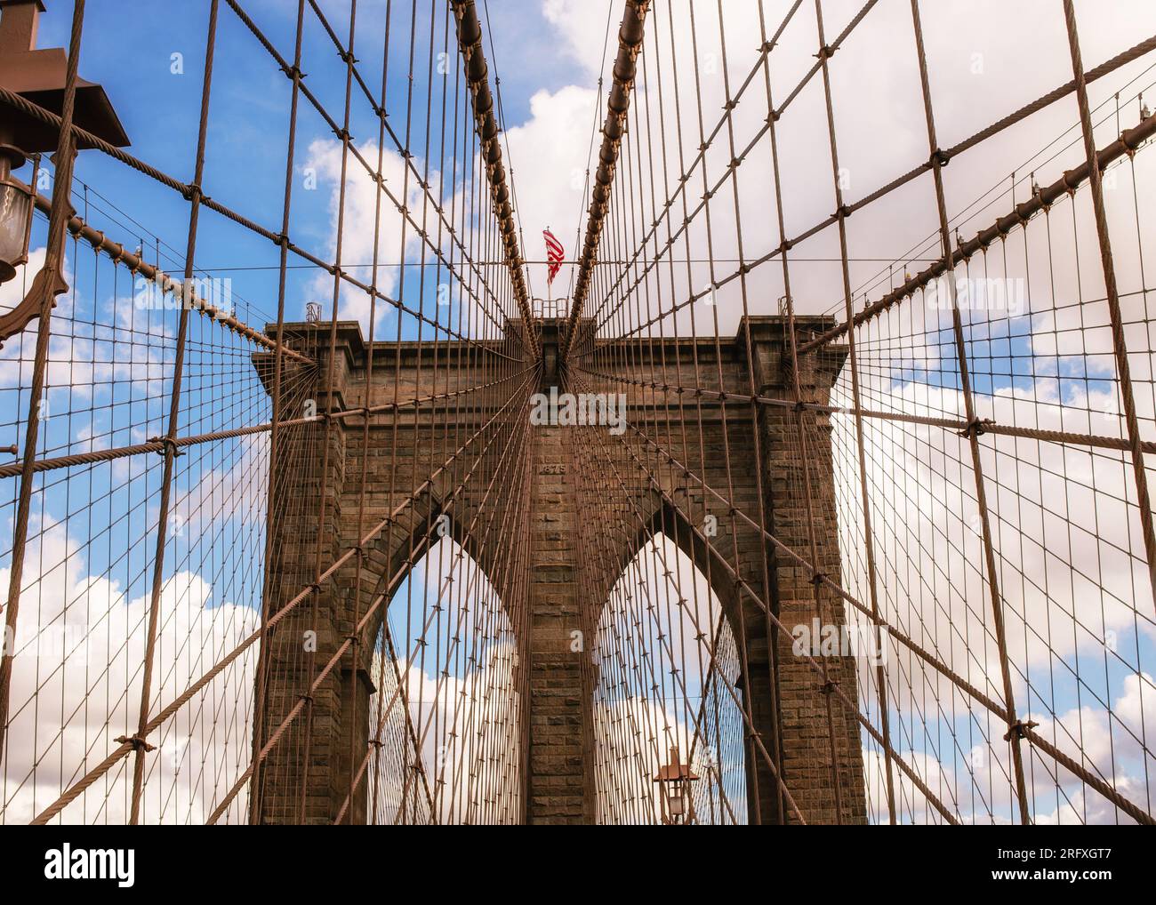 Capture the majestic allure of the Brooklyn Bridge, an architectural ...