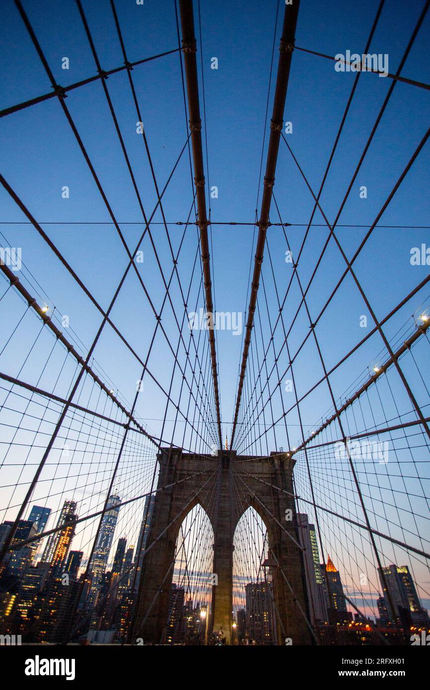 Capture the majestic allure of the Brooklyn Bridge, an architectural ...