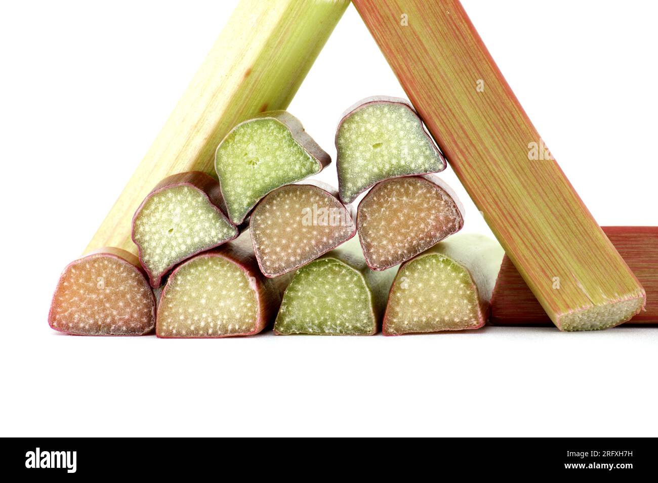 Variety of rhubarb stalks of varying colors from pale green to deep red ...