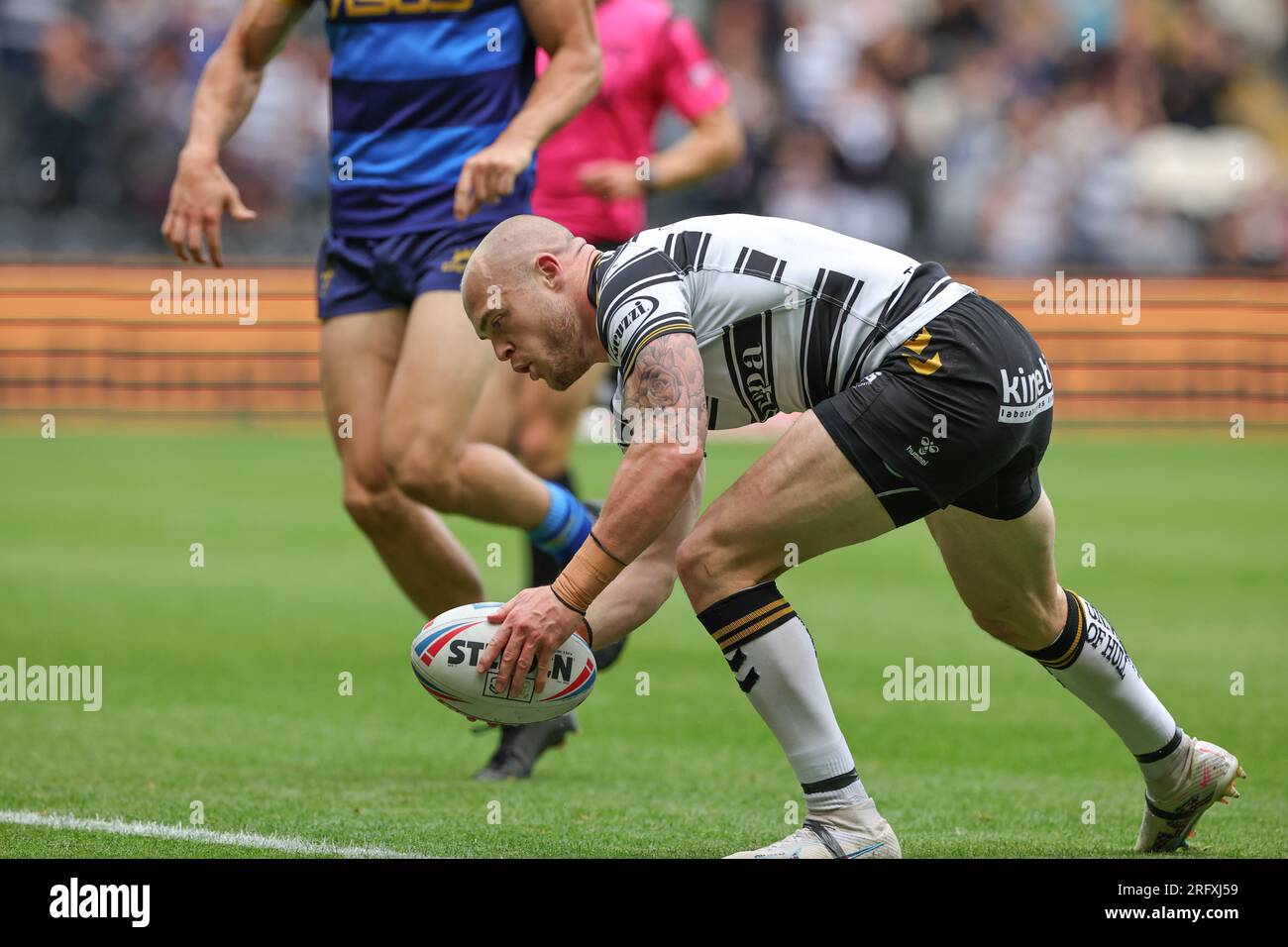 Adam Swift #2 of Hull FC breaks through for a 30 yard solo try during ...