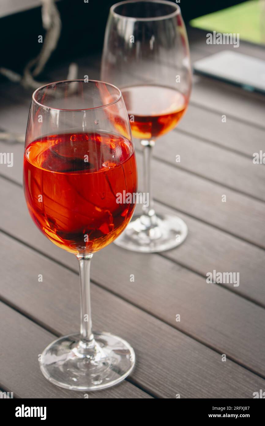 Two glasses of Aperol Spritz cocktail. Wineglasses with rose wine ...