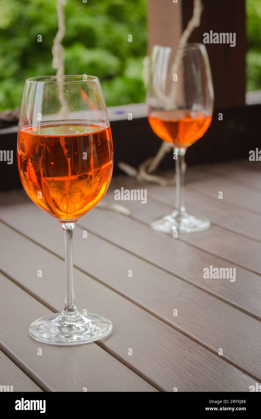 Two glasses of Aperol Spritz cocktail. Wineglasses with rose wine ...