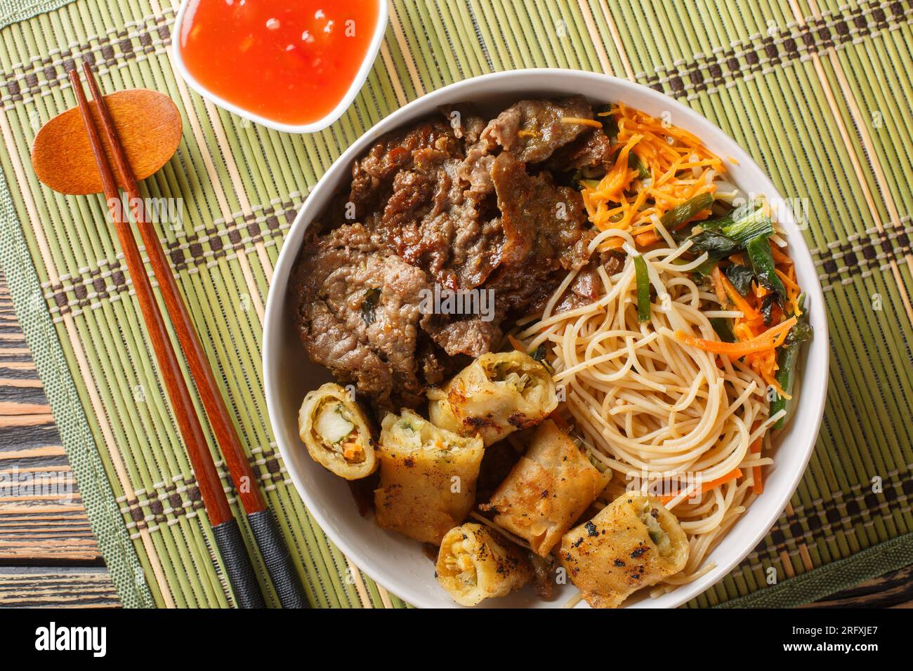 Vietnamese Beef Noodle Salad Bun Bo with crispy nem spring rolls and ...