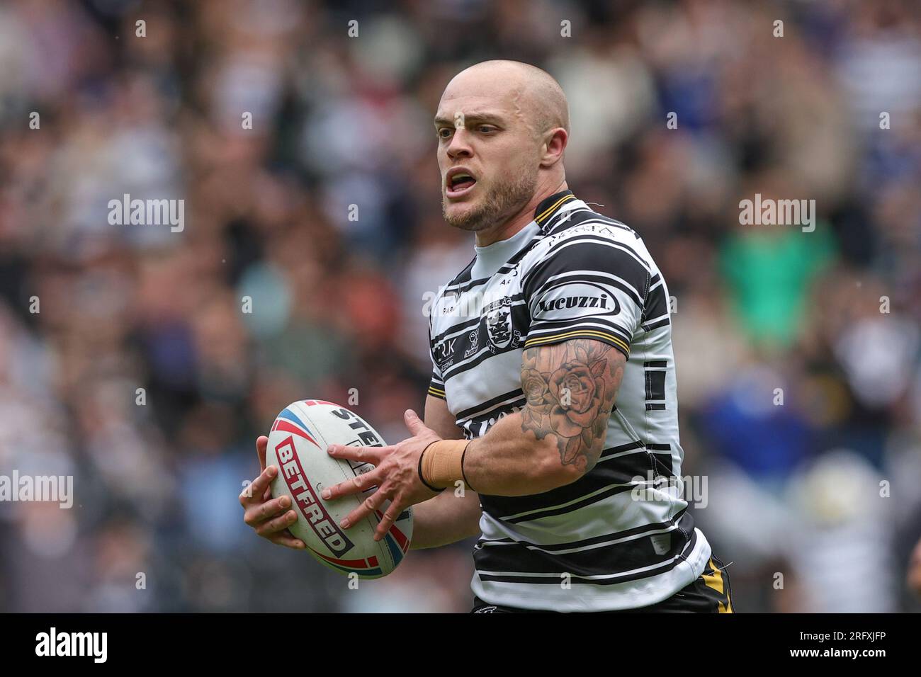 Adam Swift #2 of Hull FC breaks through for a 30 yard solo try during ...