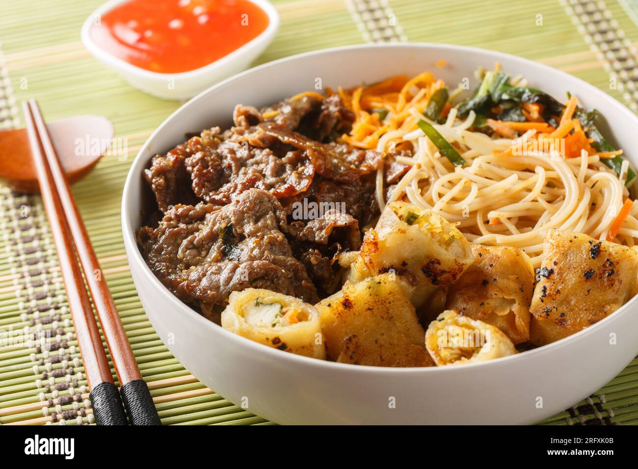 Vietnamese Beef Noodle Salad Bun Bo with crispy nem spring rolls and ...