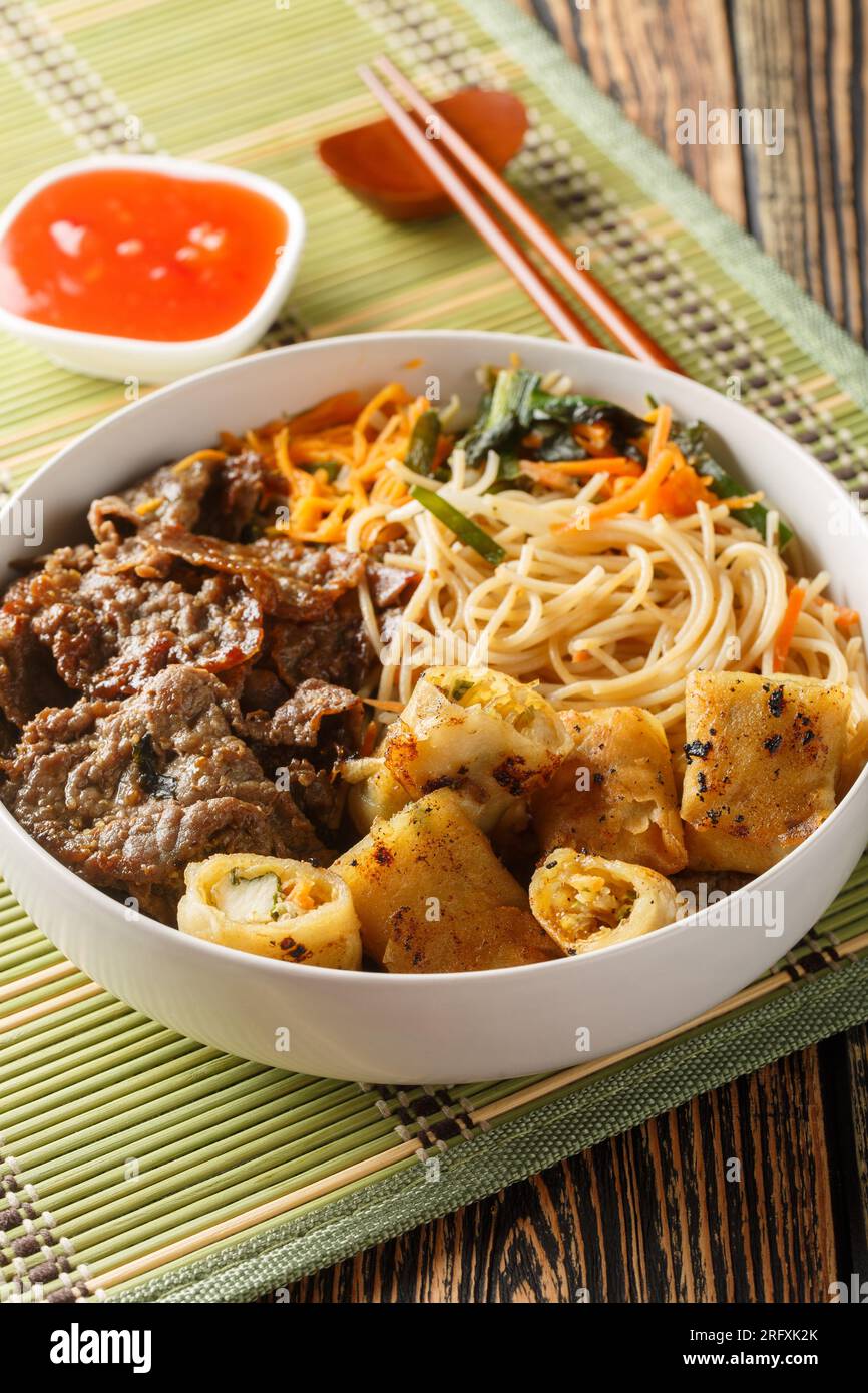 Vietnamese salad of beef and soy sauce, with crispy spring rolls and ...