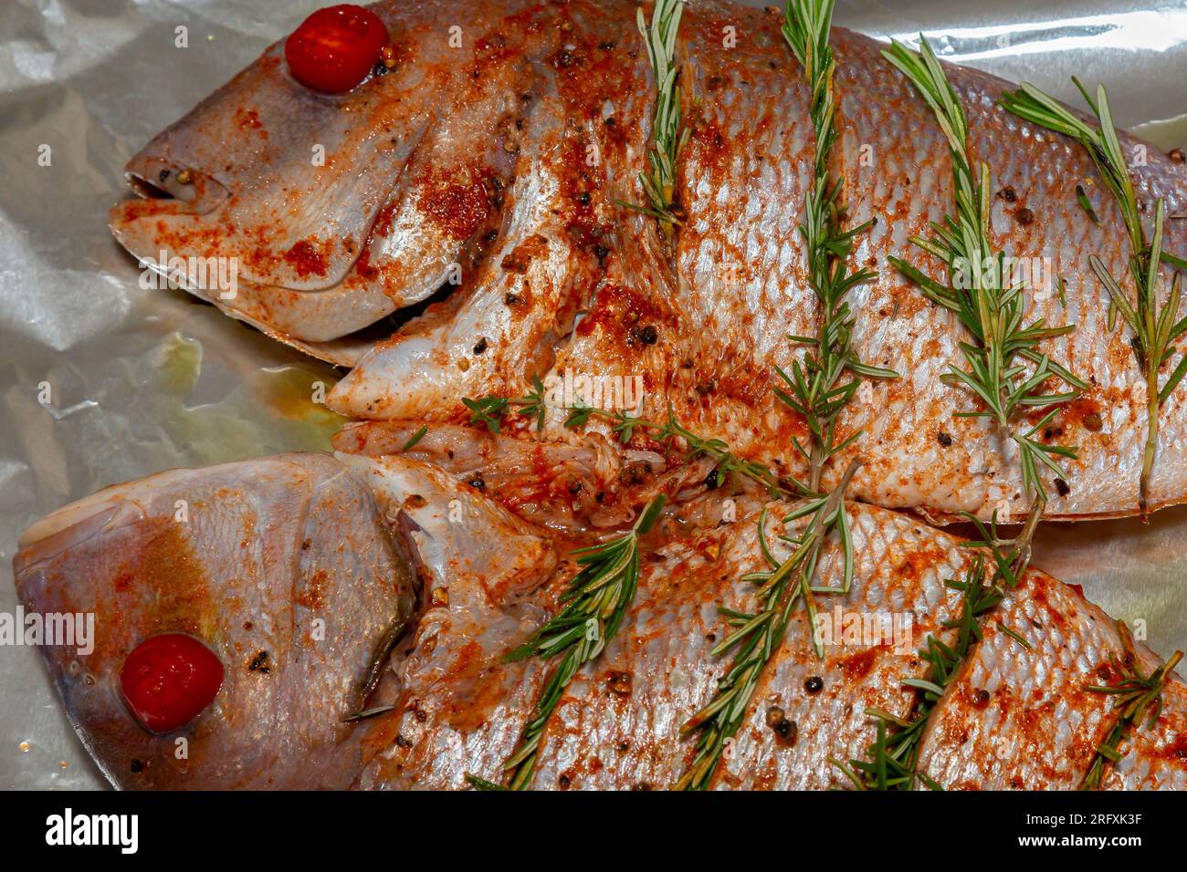 Traditional roast snapper fish with rosemary and sautéed potatoes Stock ...