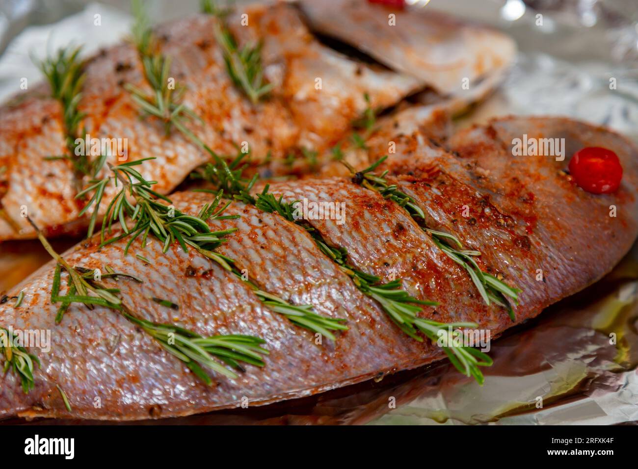 Traditional roast snapper fish with rosemary and sautéed potatoes Stock ...