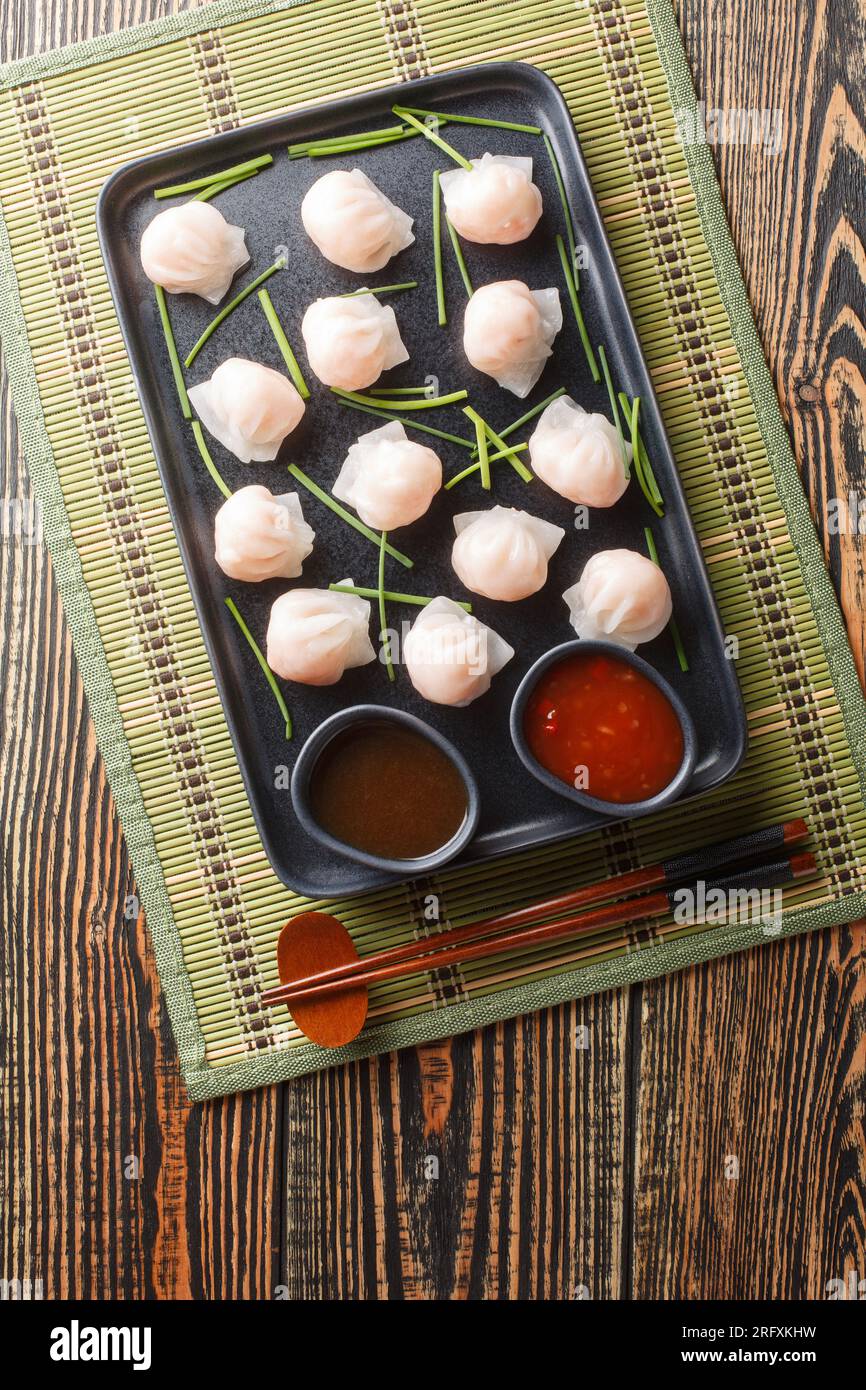 Chinese Har Gow Dim Sum dumplings in the shape of a bonnet served with ...