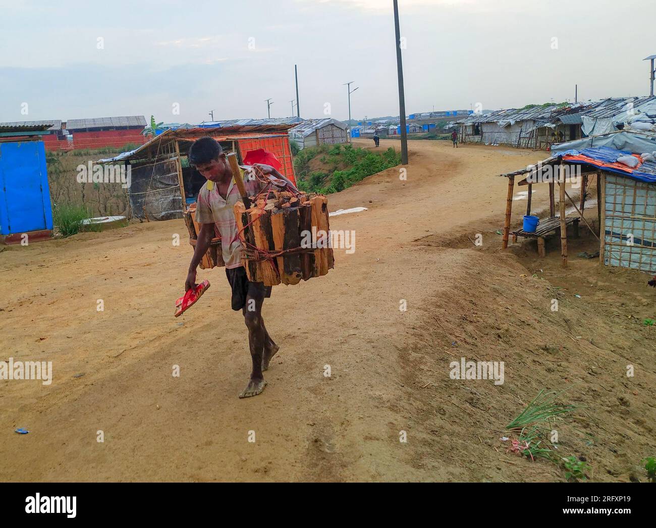 Rohingya man is carrying fire wood in refugee camp of Bangladesh Stock ...