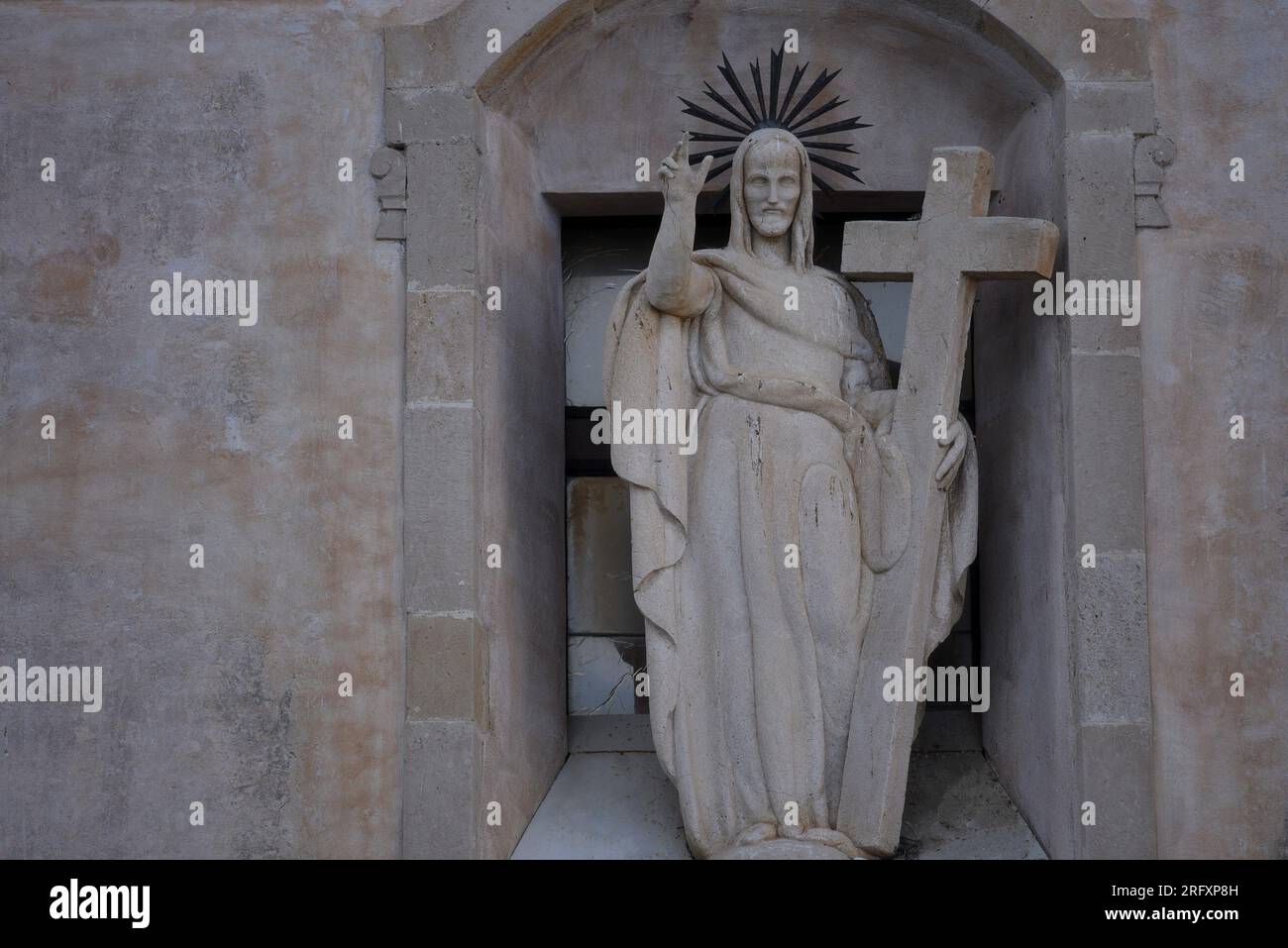Pink marble statue of Jesus on the facade of the Baroque style Chiesa ...