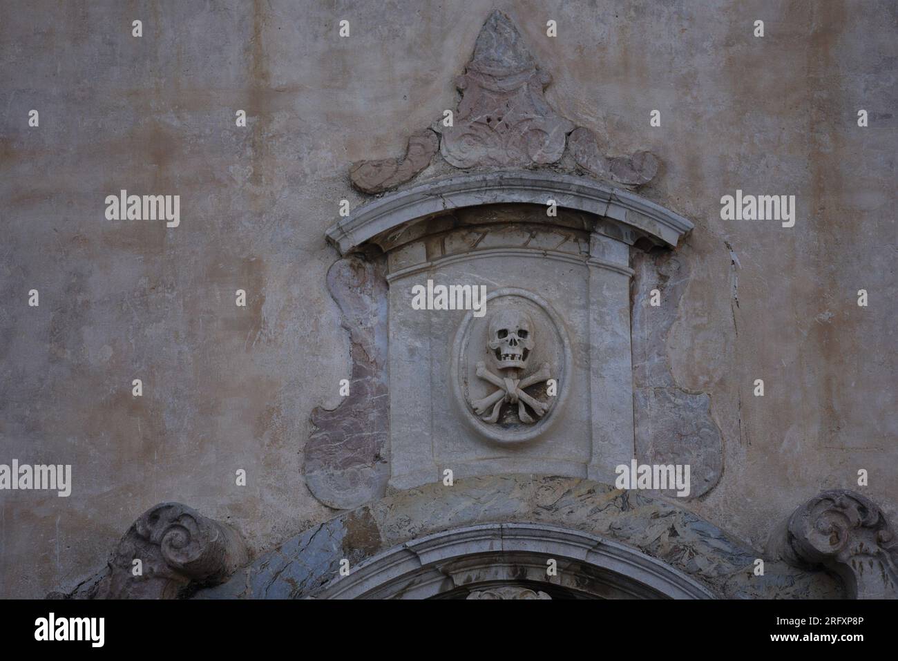 Pink marble hand carved dead head skull symbol on the facade of the ...