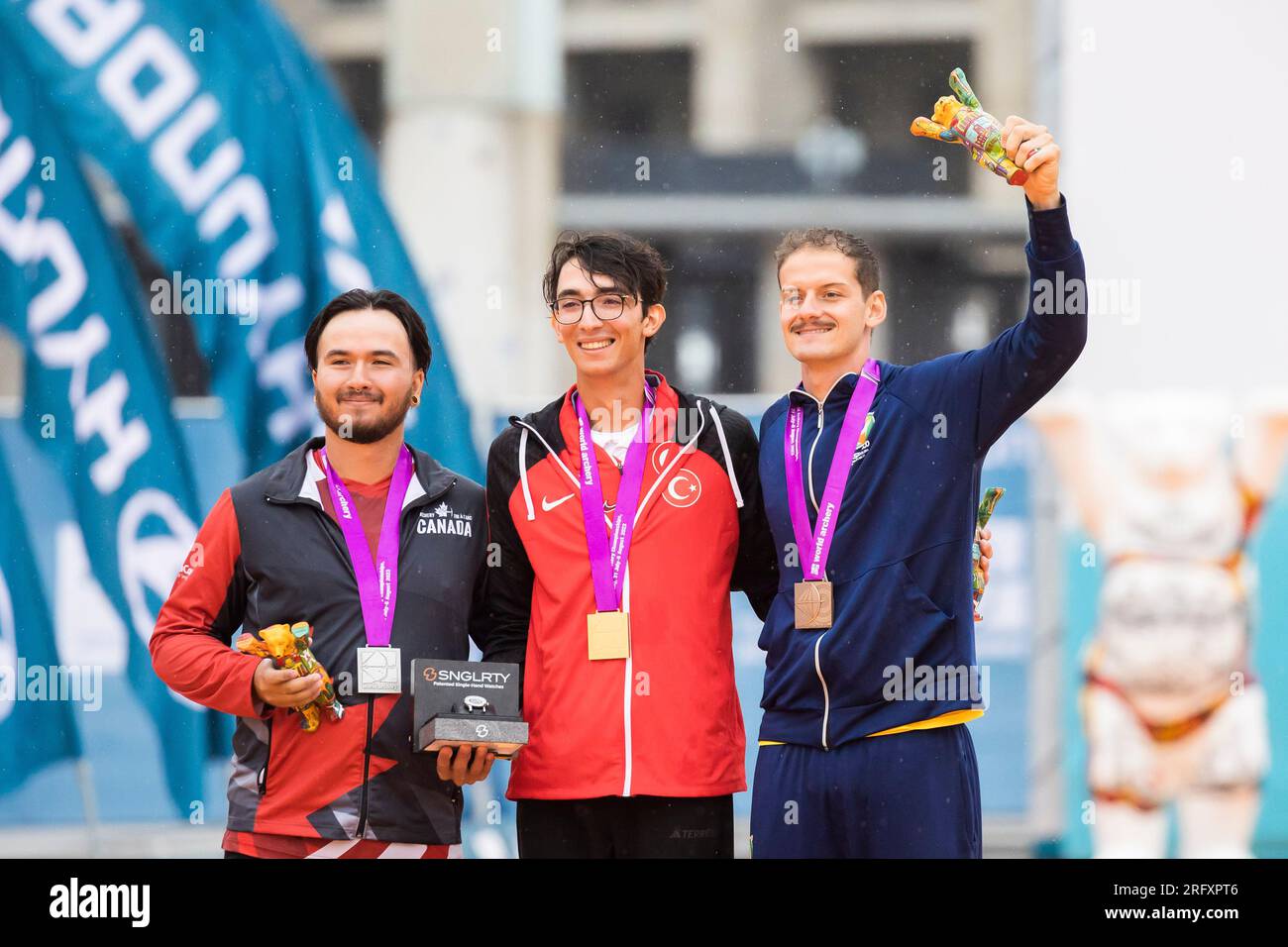 From left, silver medalist Eric Peters from Canada, gold medalist Mete ...