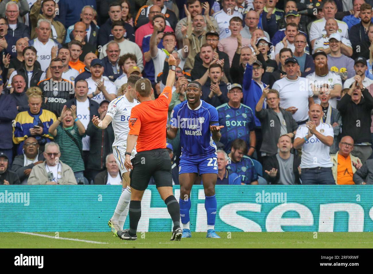 Yakou Méïte #22 of Cardiff City receives a yellow card from referee ...