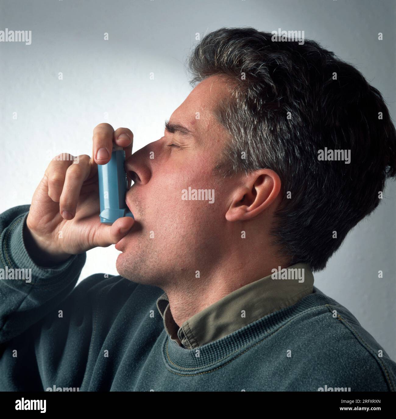 Man using inhaler Stock Photo - Alamy