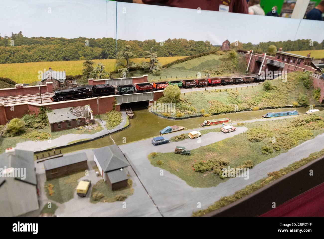 N gauge model railway on display at an exhibition. Rural scene with ...
