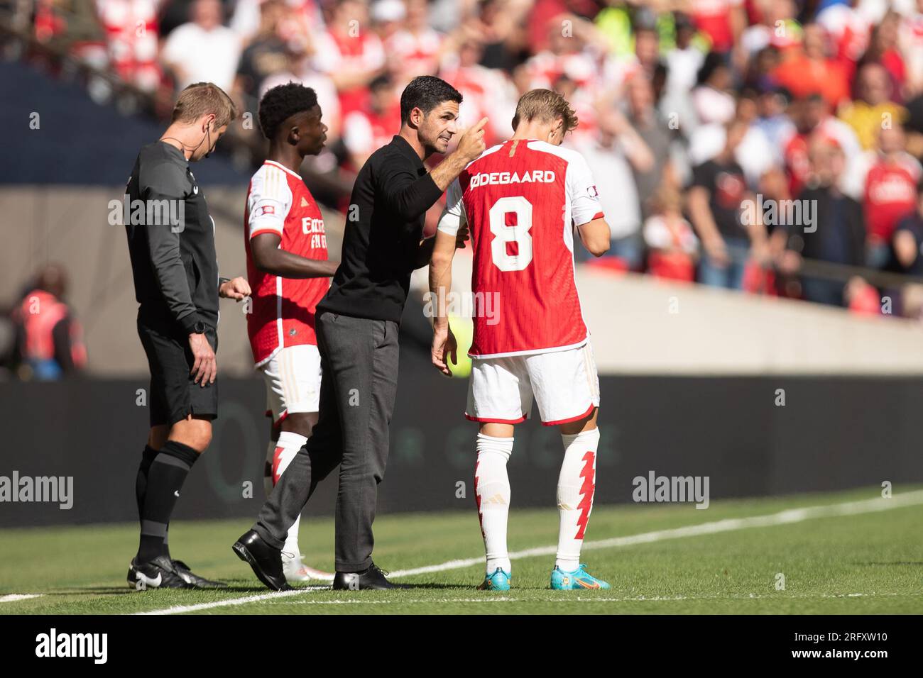 Mikel Arteta of Arsenal and Martin Odegaard of Arsenal gestures during ...