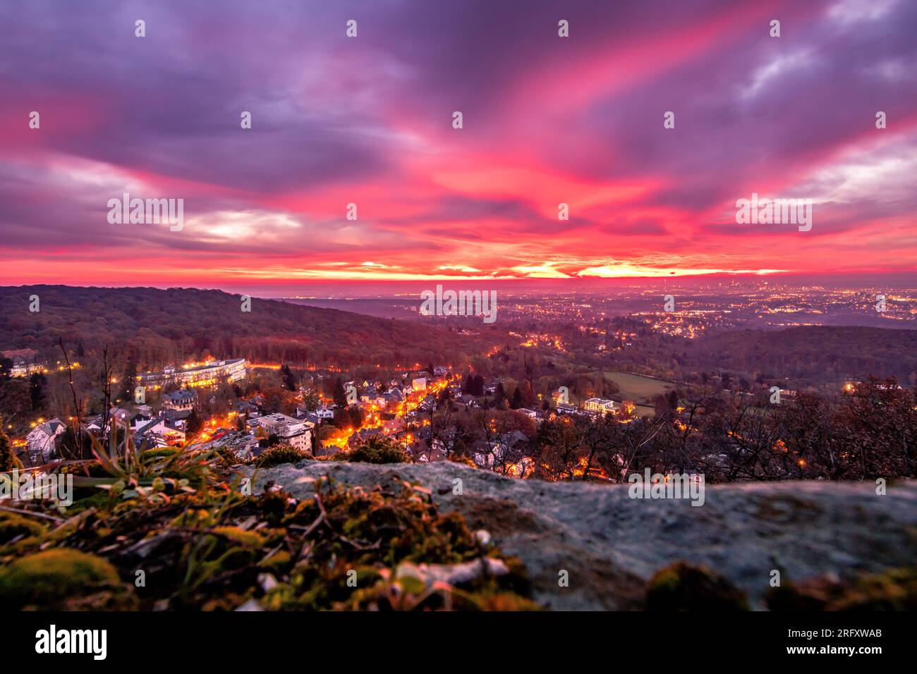 Backlit shot on a mountain with a view of the landscape, sunset, forest ...