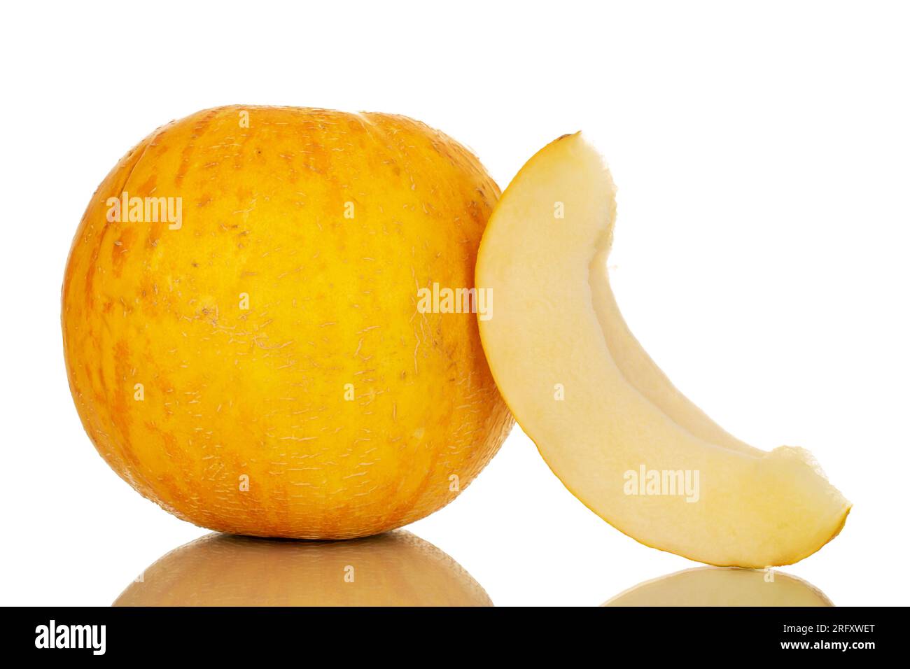 One yellow melon with one slice, macro, isolated on white background ...