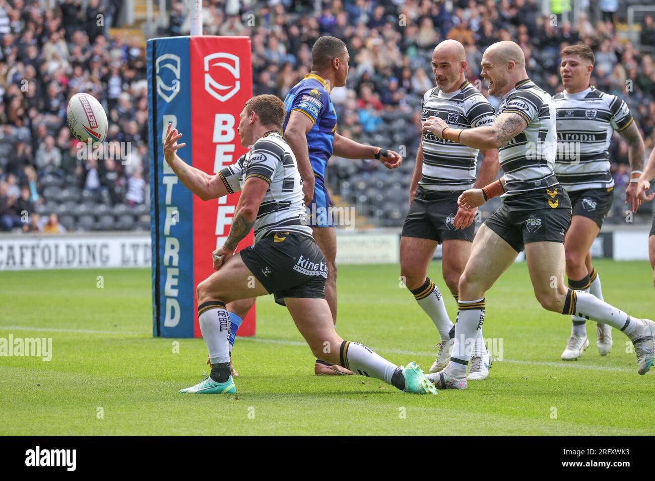 Jordan Lane #12 of Hull FC celebrates his try with his team mates ...