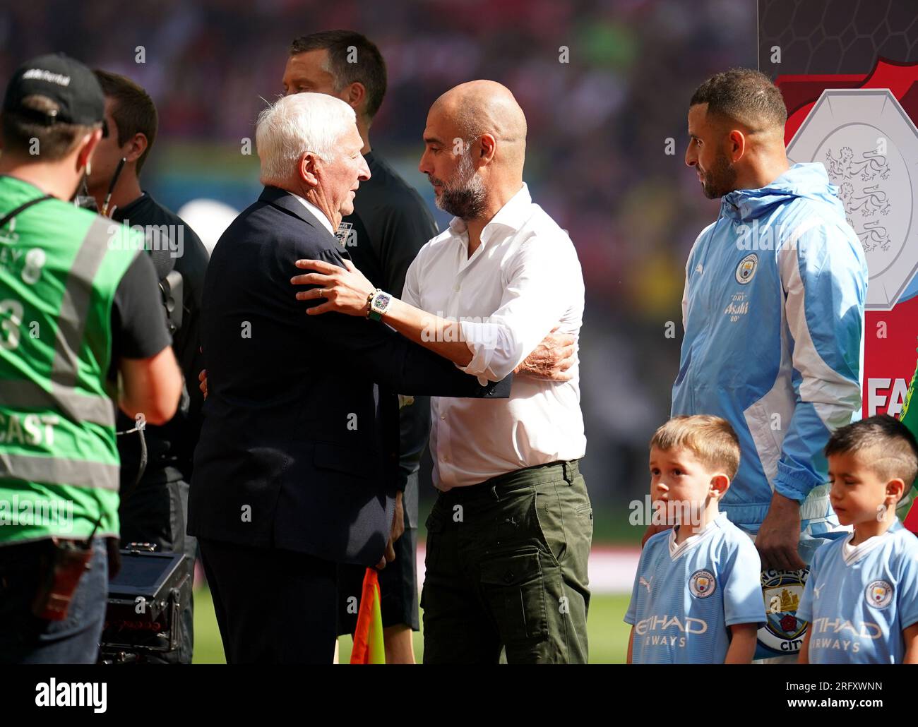 Former Manchester City player Mike Summerbee shakes hands with Pep ...