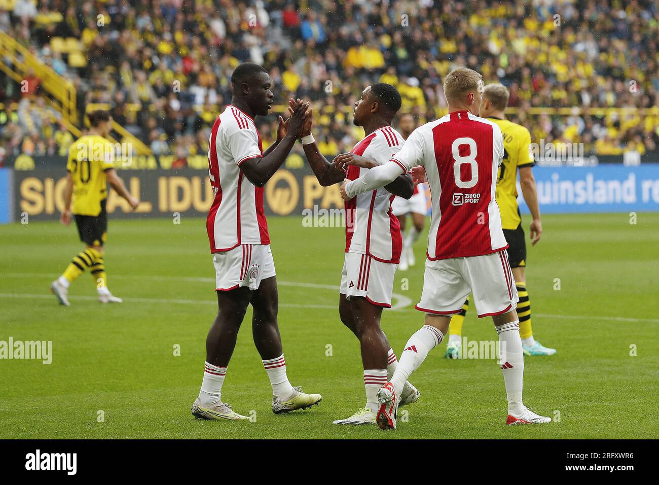 DORTMUND - (lr) Brian Brobbey of Ajax, Steven Bergwijn of Ajax, Kenneth Taylor of Ajax celebrate ...