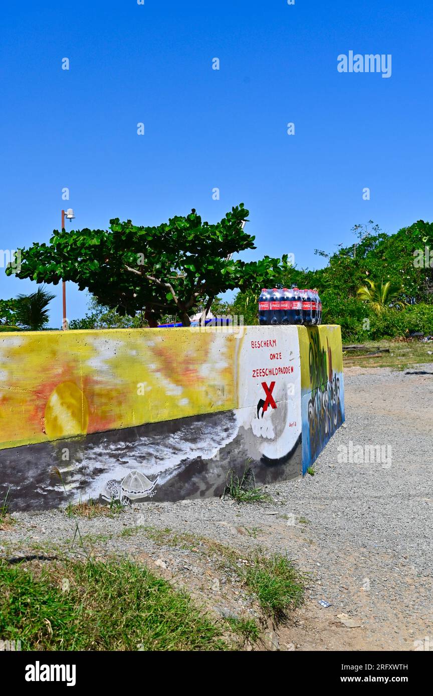 Wall with mural in Nieuw Amsterdam, Suriname, calling for sea turtle ...