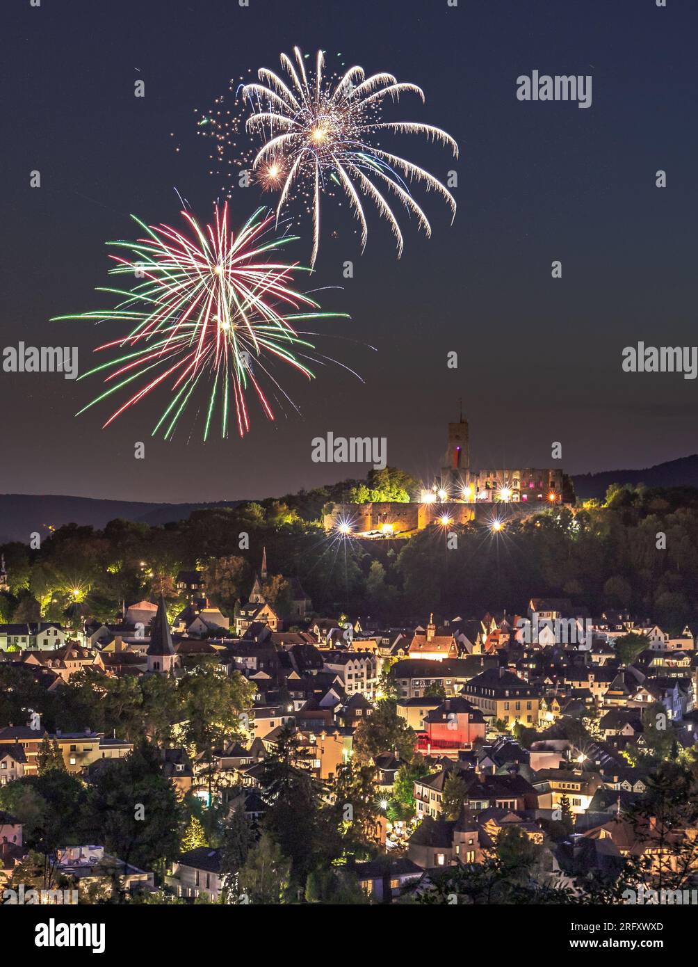 fireworks over a ruined castle over a city. beautiful fireworks with ...