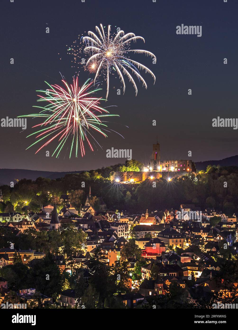fireworks over a ruined castle over a city. beautiful fireworks with ...