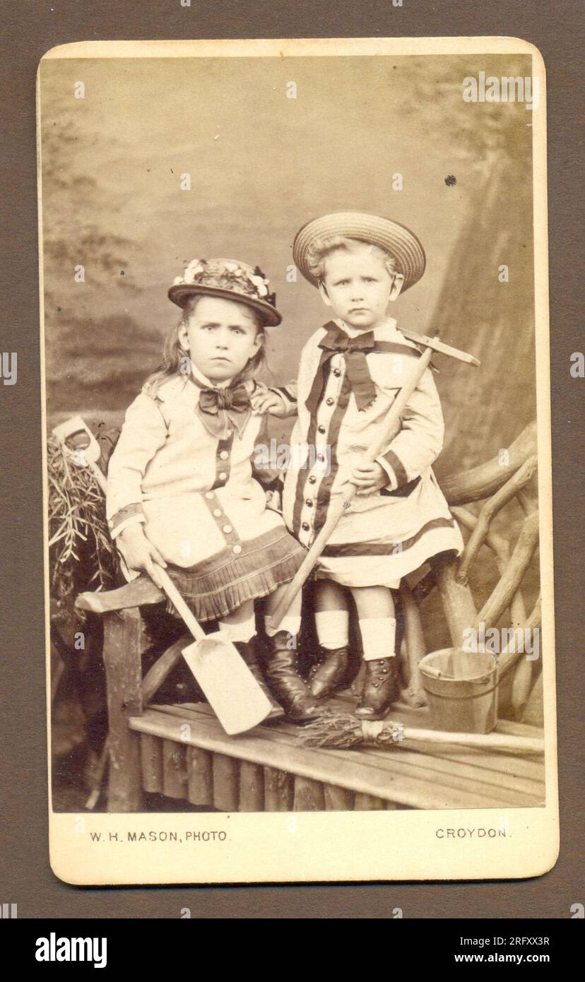 Carte de visite studio portrait of two reluctant children with seaside ...