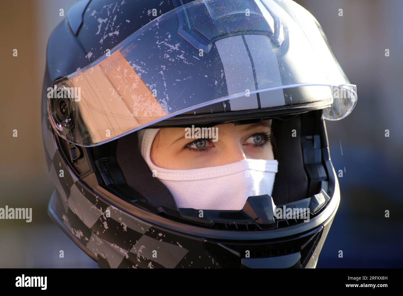 Symbol image: Female race car driver wears helmet and balaclava (Model ...