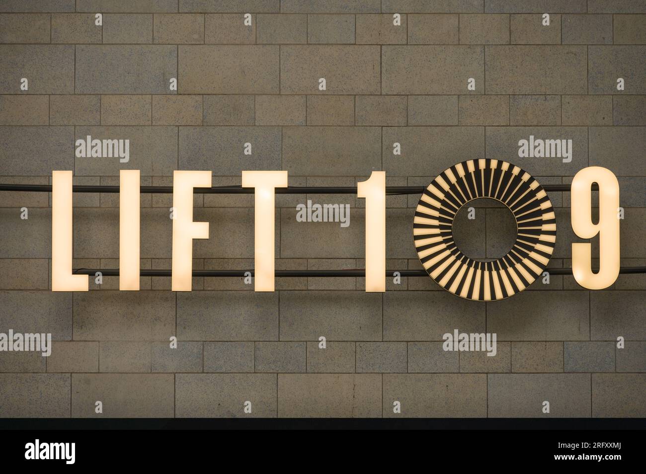 The Lift 109 sign lit up on one of the interior walls of the Battersea ...