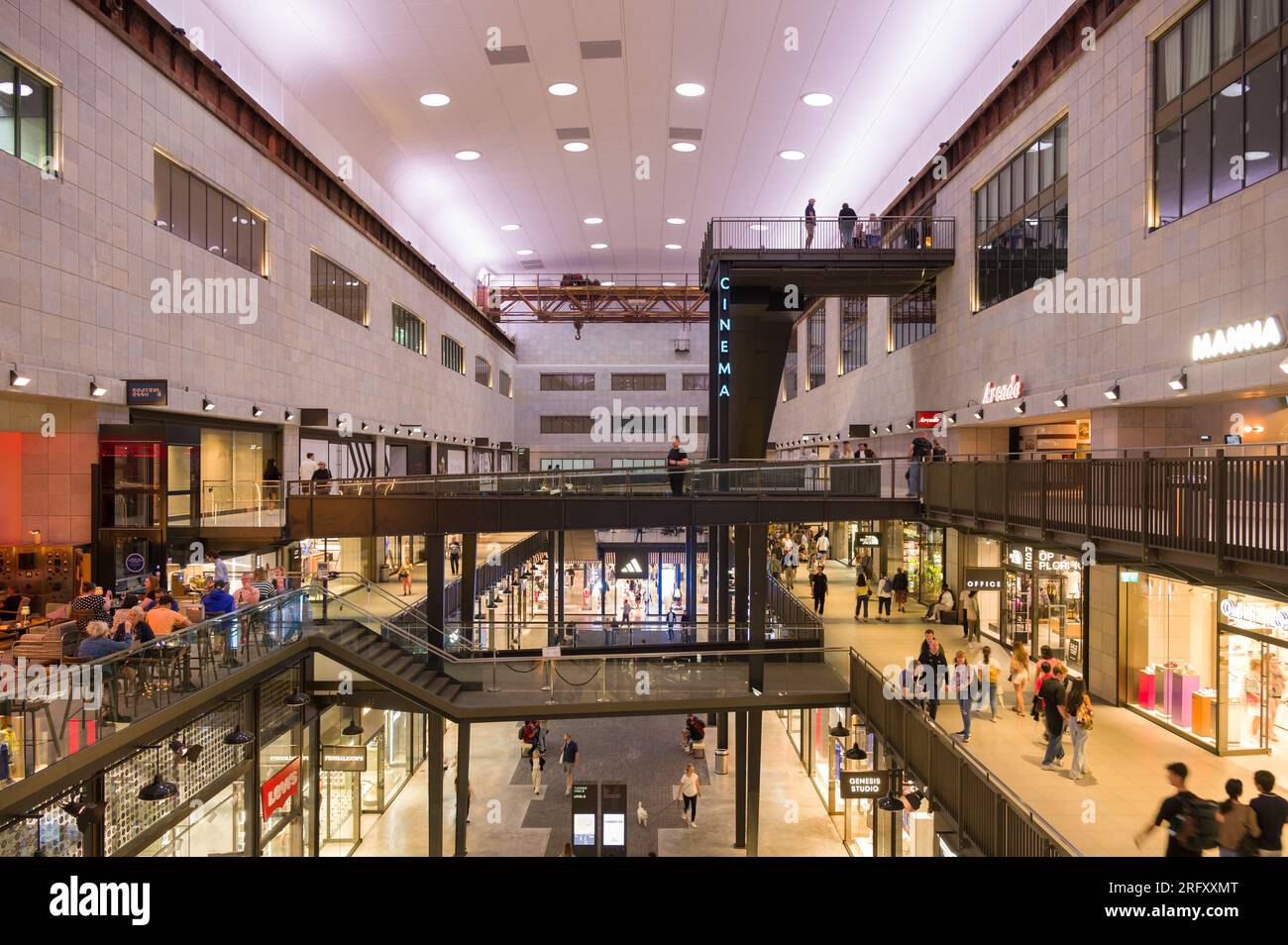 Interior of Battersea Power Station showing people walking past retail ...