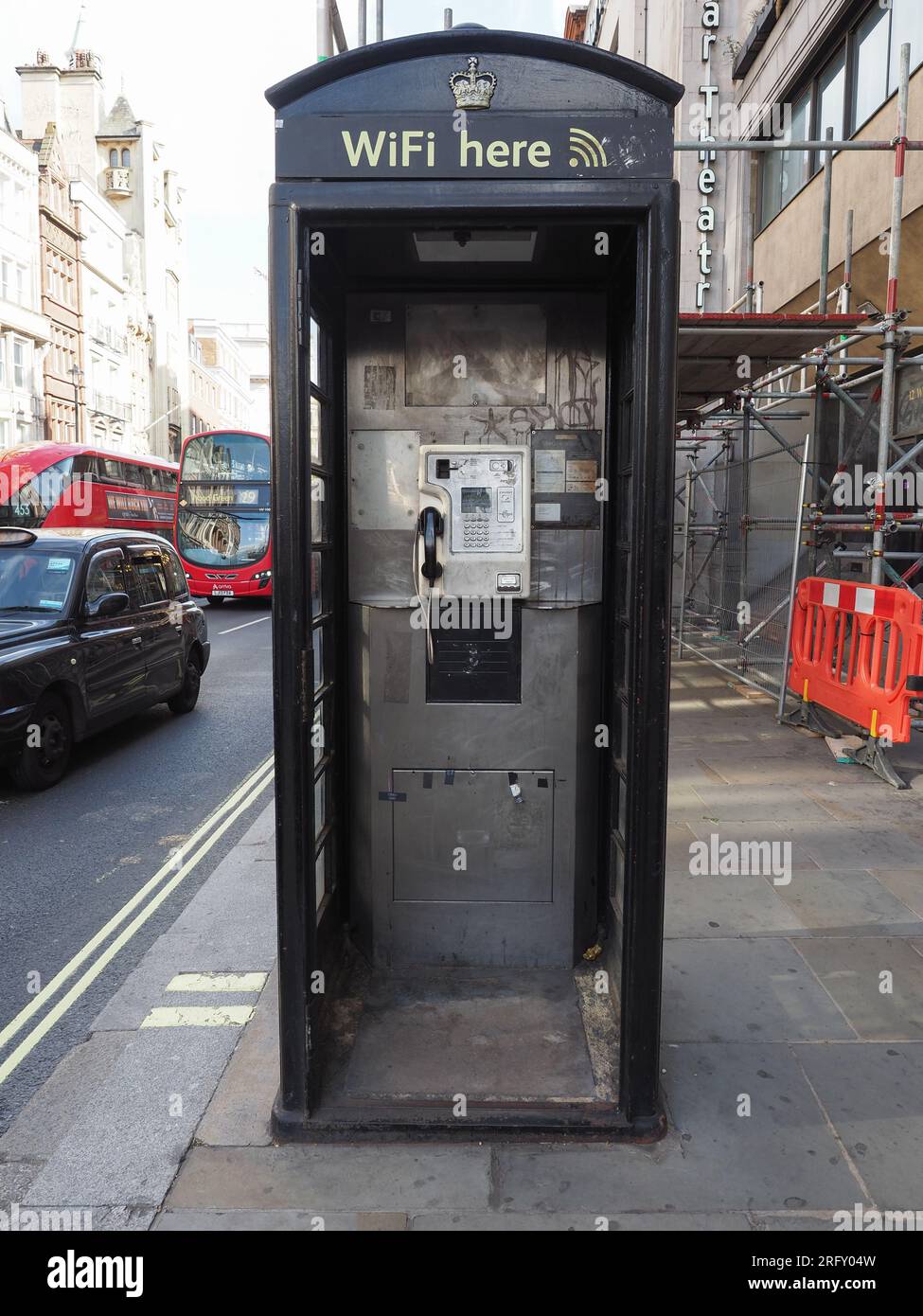 LONDON, UK - JUNE 06, 2023: Vintage black public telephone box ...