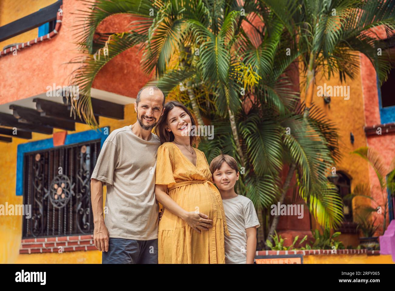 A loving couple in their 40s and their teenage son cherishing the ...