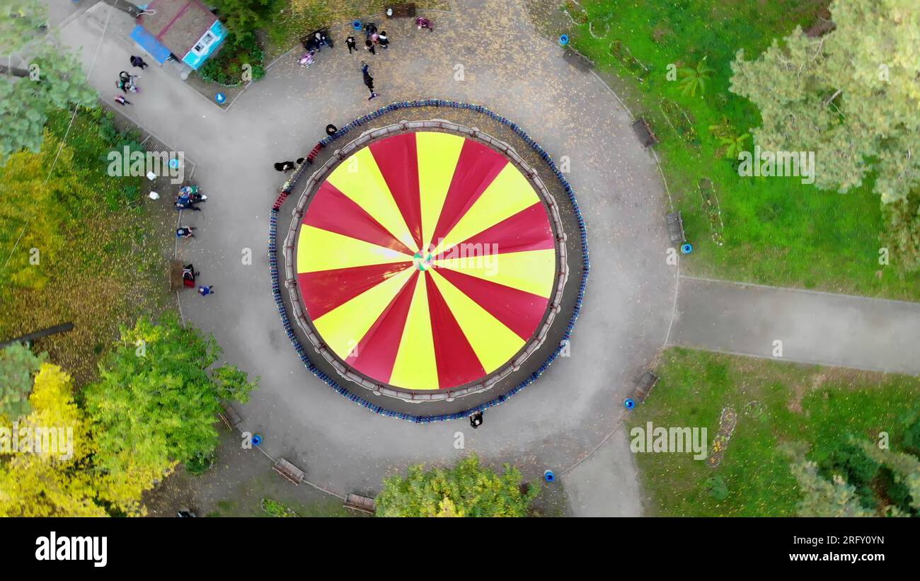 Colourful, red and yellow carousel, a carnival Merry Go Round, in the ...