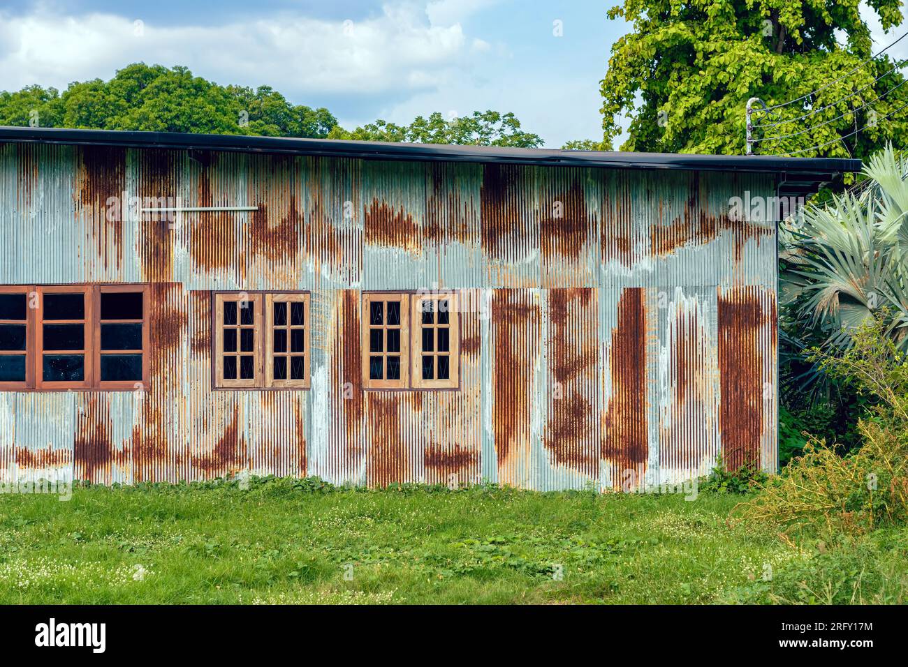 Facade house with old zinc wall. Beautiful vintage galvanized sheet ...