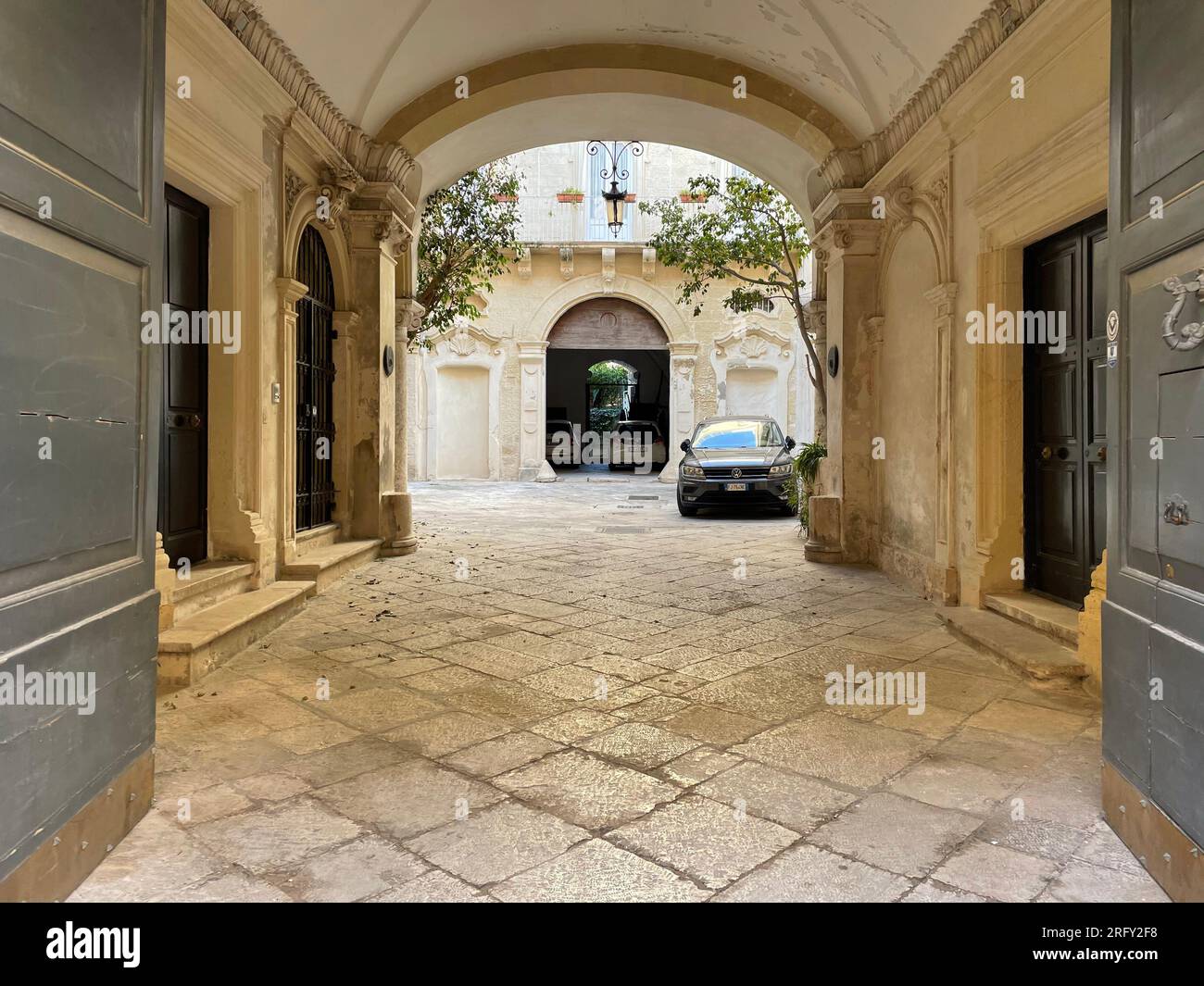 Courtyard seen through an arched passage in the historical center of ...