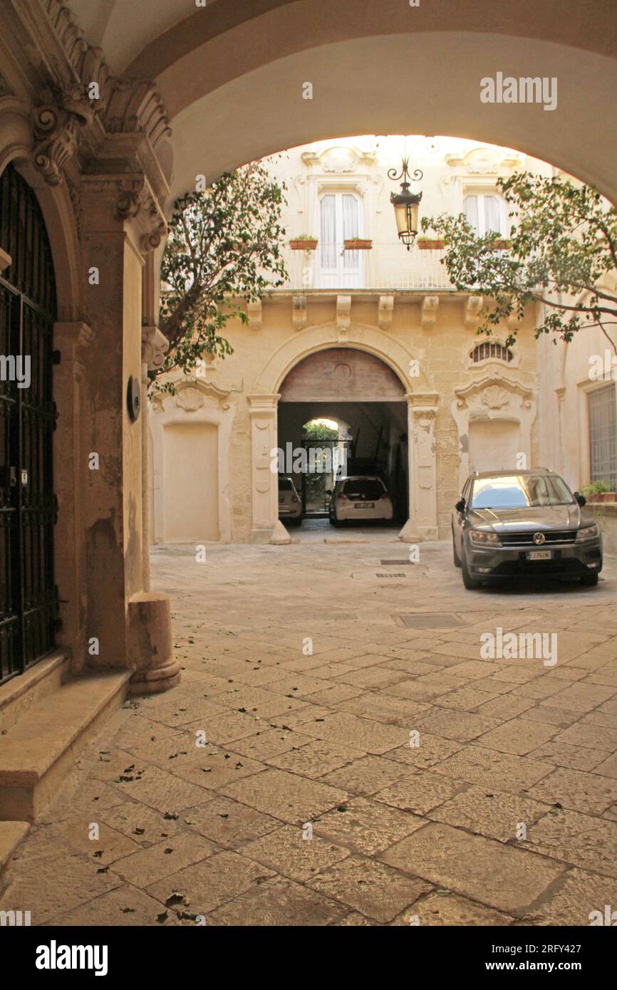 Buildings seen through stone arch hi-res stock photography and images ...