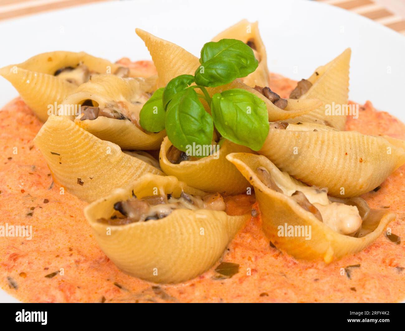 Conchiglie pasta with mushrooms Stock Photo - Alamy