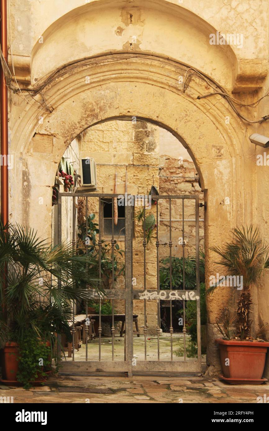Gate to a courtyard in the historical center of Lecce, Italy Stock ...
