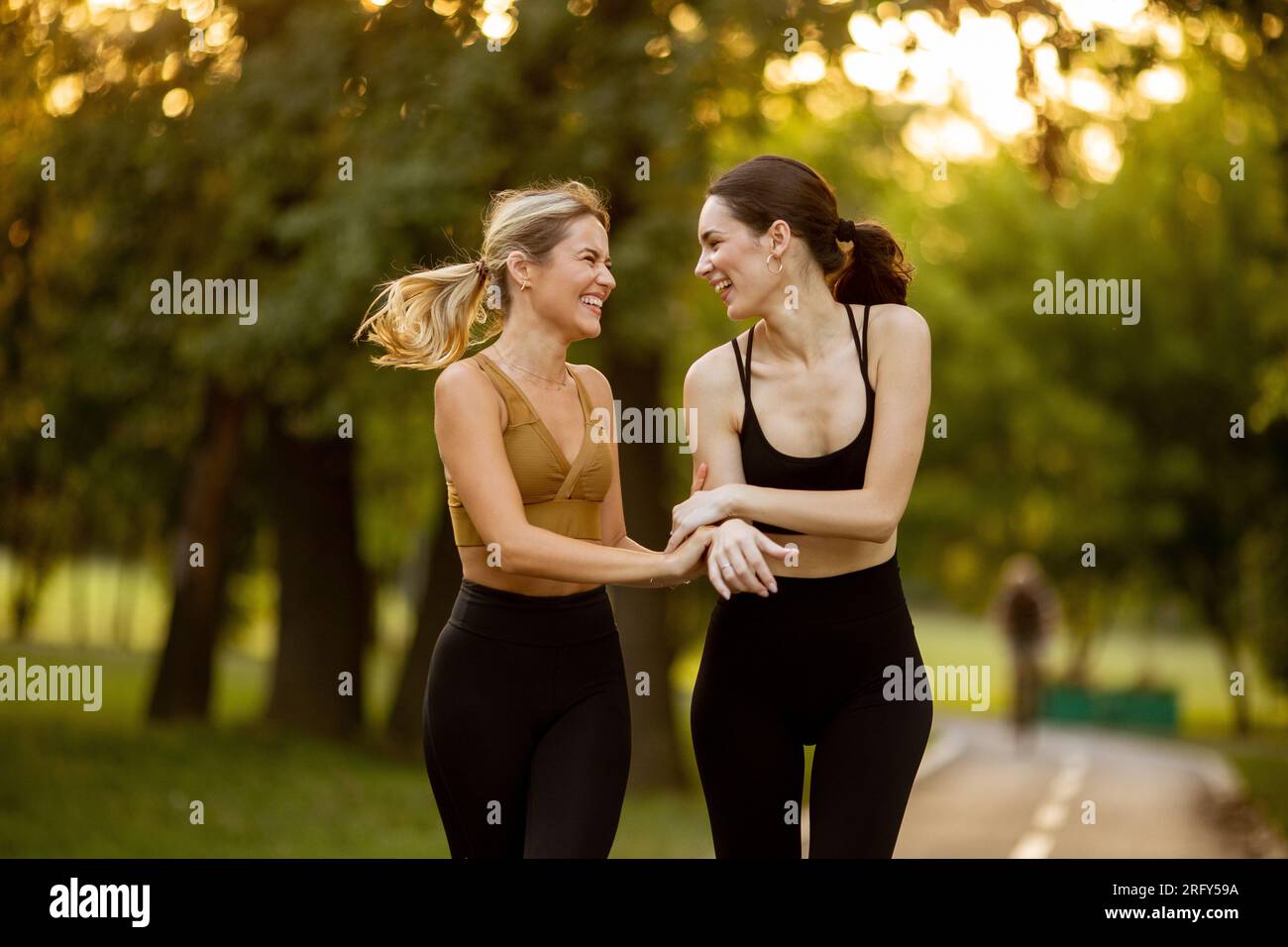 Two young women running in a forest hi-res stock photography and images ...