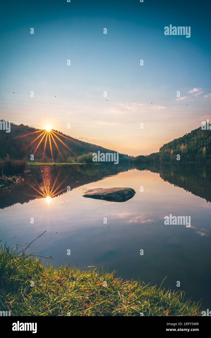 one of the most beautiful sunsets i have ever seen, a calm reservoir in ...