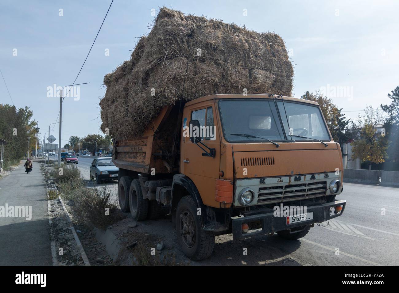 Old Kamaz dump truck with enormous amount of hay brickets in Kyrgyzstan ...