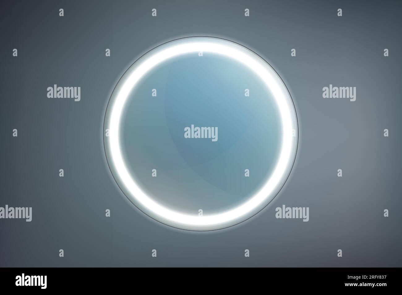 Round bathroom or vanity mirror with white LED backlit on a dark ...