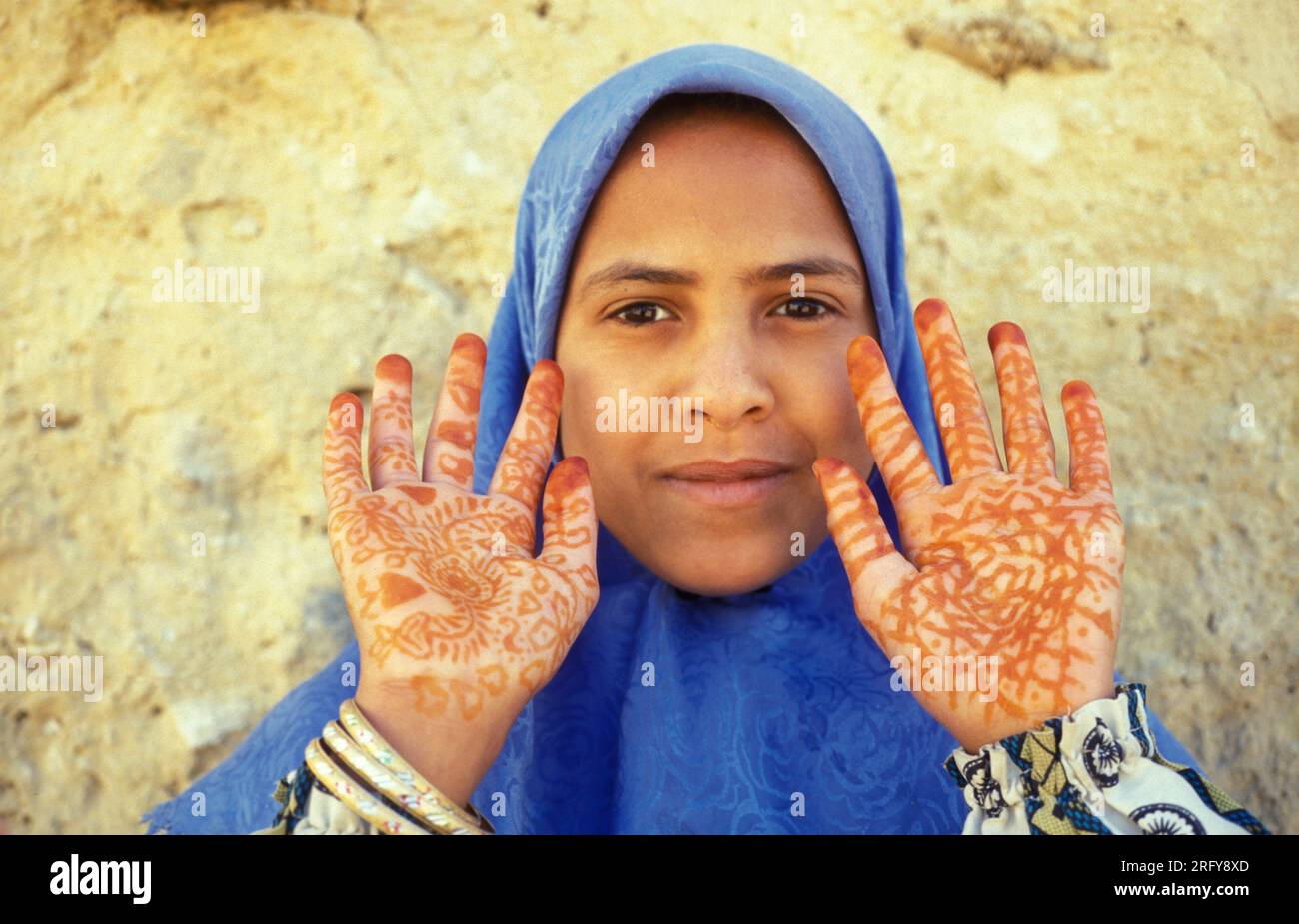 a girl with Hand Henna painting in the Town and Oasis of Farafra in the ...