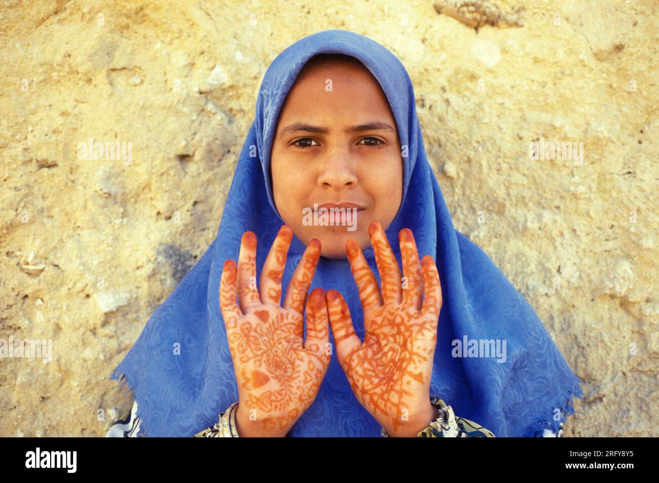a girl with Hand Henna painting in the Town and Oasis of Farafra in the ...
